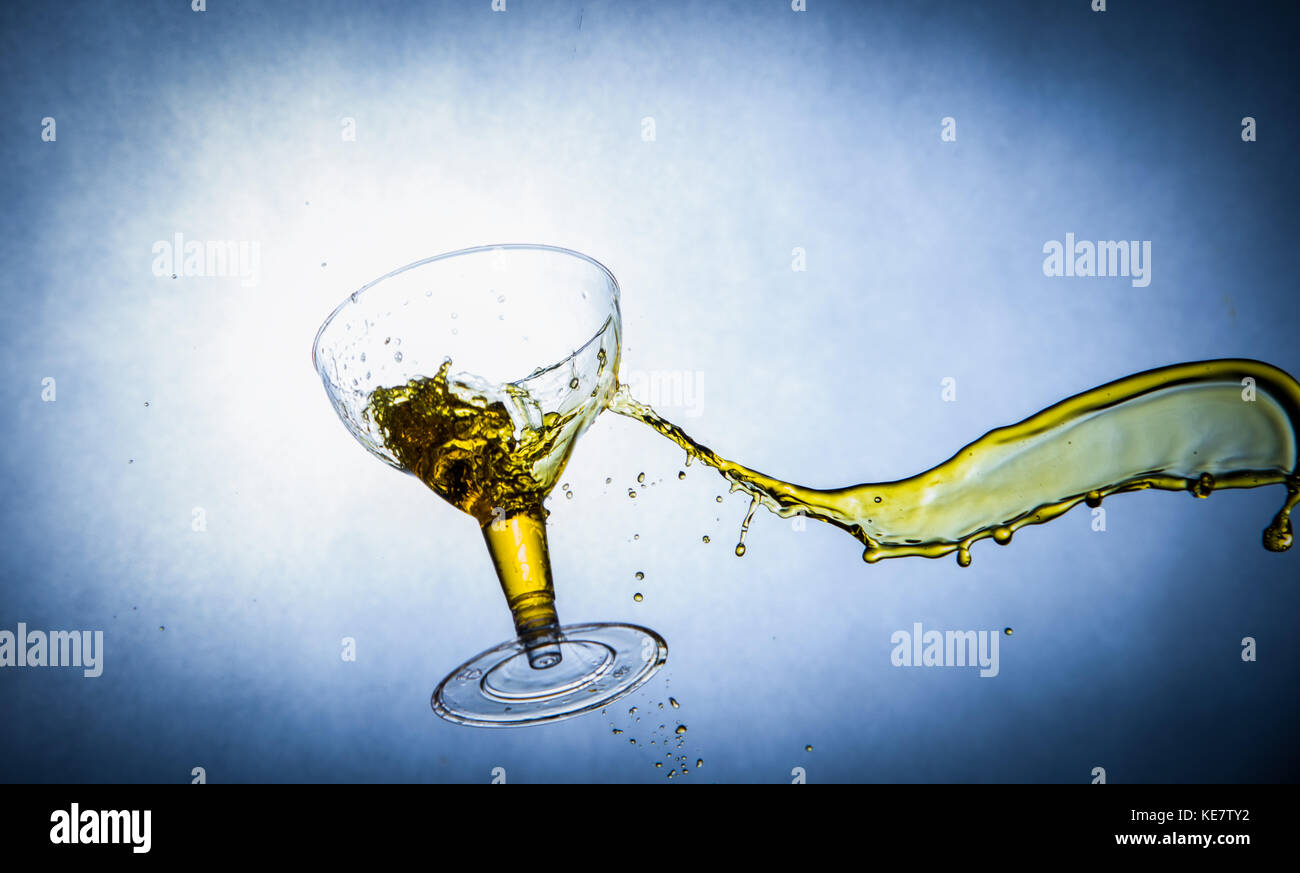 Fluid spill from glasses Stock Photo - Alamy