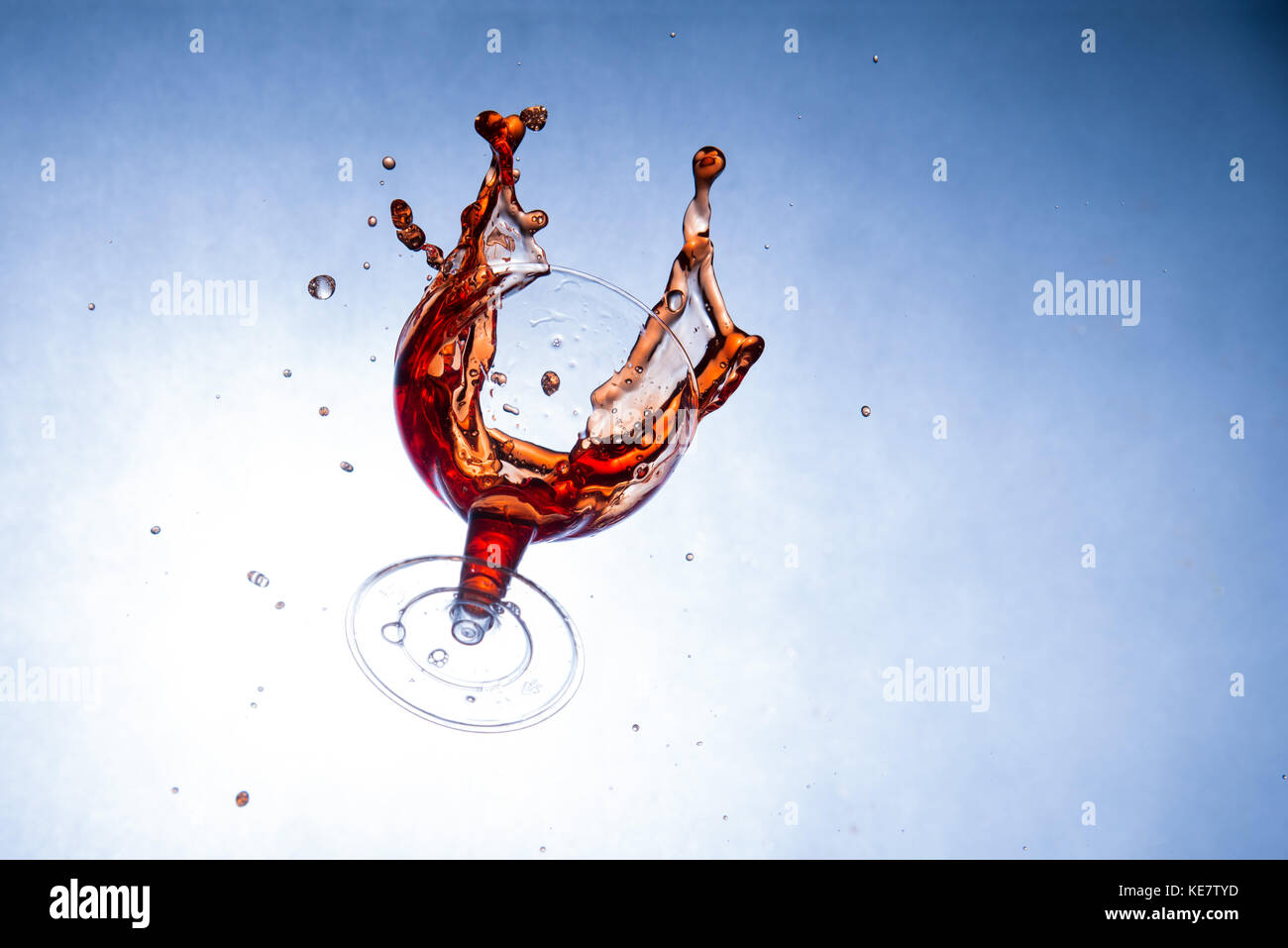 Fluid spill from glasses Stock Photo - Alamy