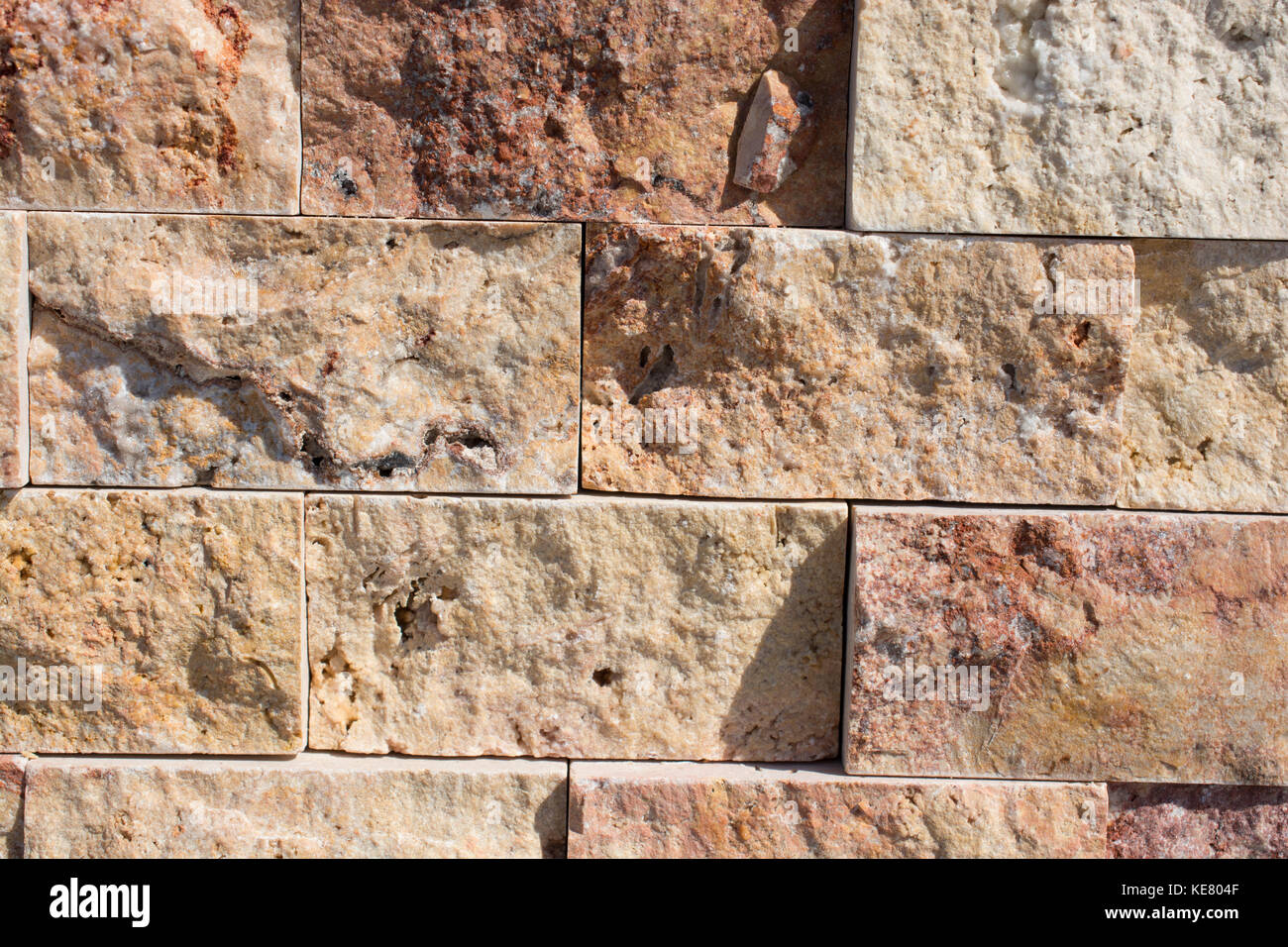 Decorative cubic stone wall as background texture Stock Photo - Alamy