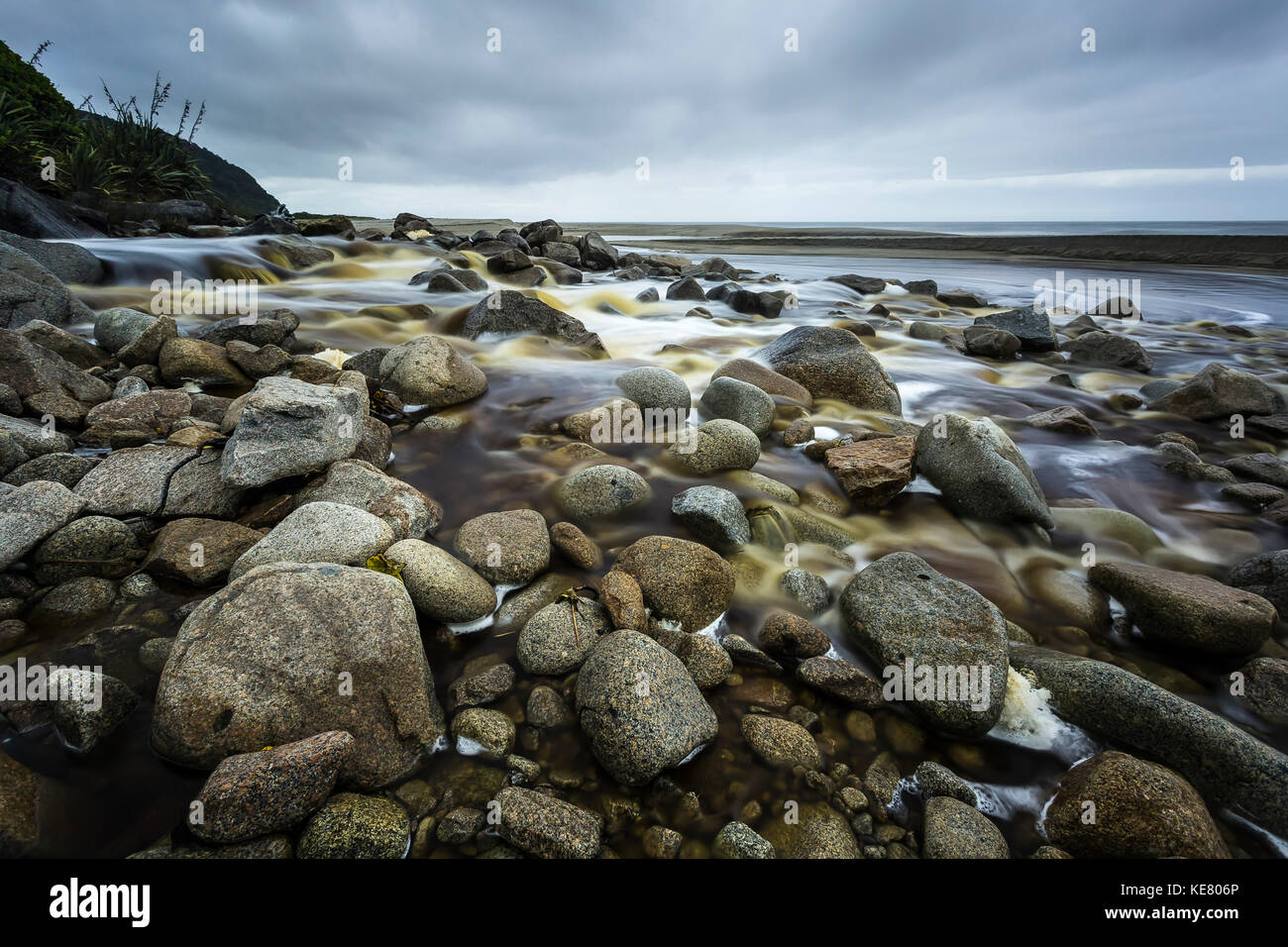 Rocky Karamea stream making it's way to the sea; Karamea, New Zealand ...