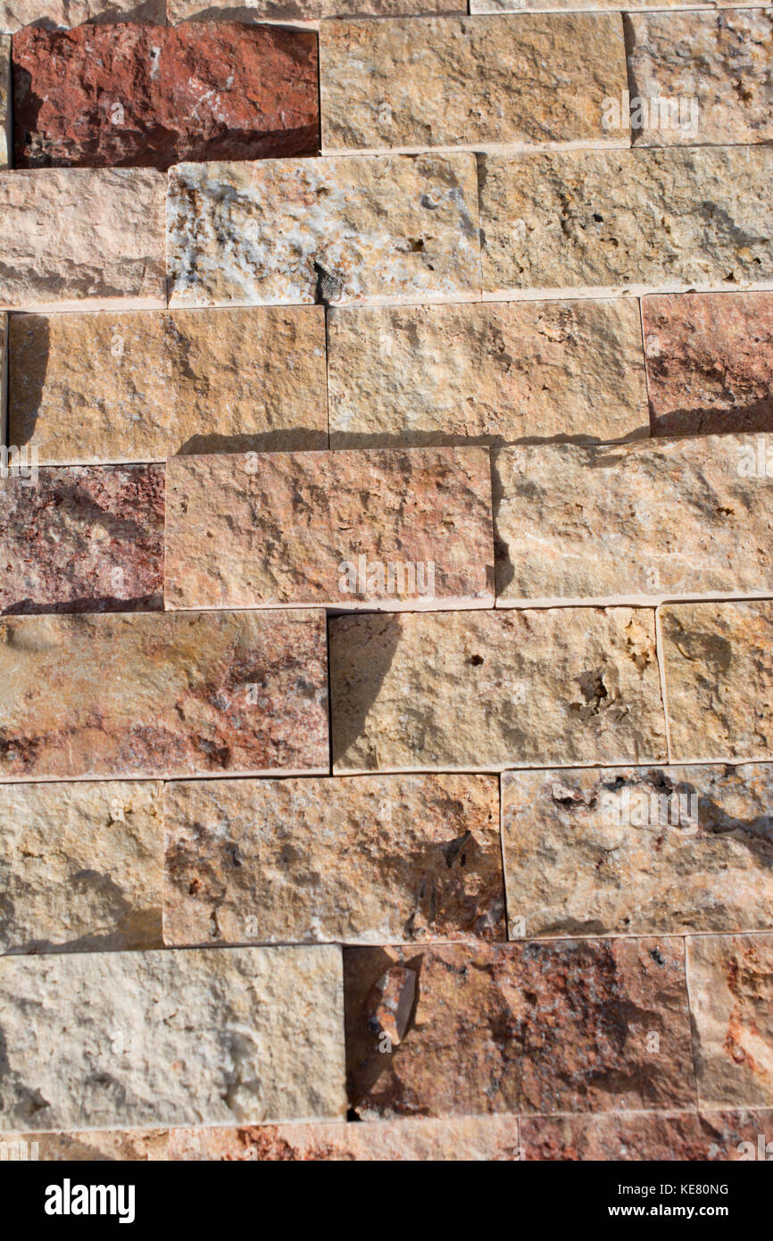 Decorative cubic stone wall as background texture Stock Photo - Alamy