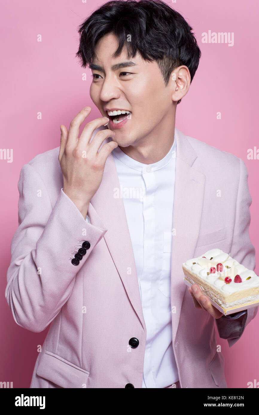 Man holding cake laughing hi-res stock photography and images - Alamy