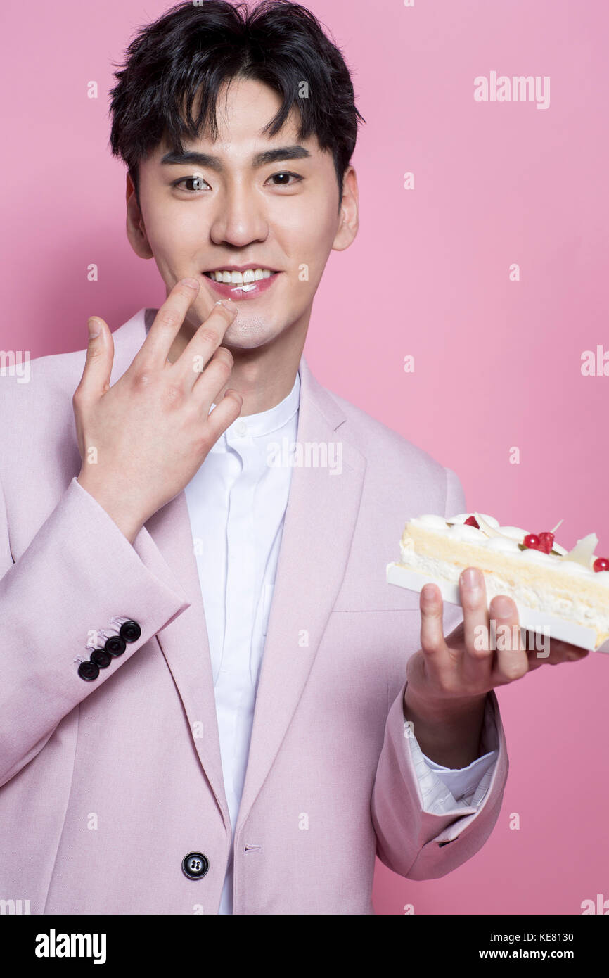 Man holding cake laughing hi-res stock photography and images - Alamy