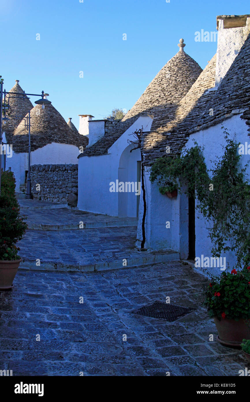 Trulli in Alberobello in the setting sun Stock Photo - Alamy