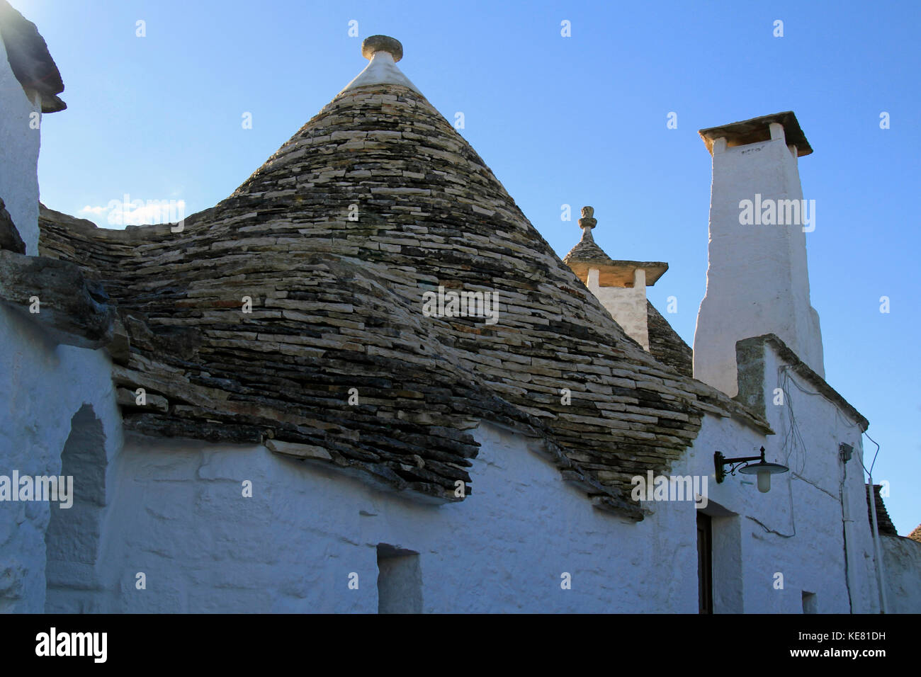 Trulli in Alberobello in the setting sun Stock Photo - Alamy