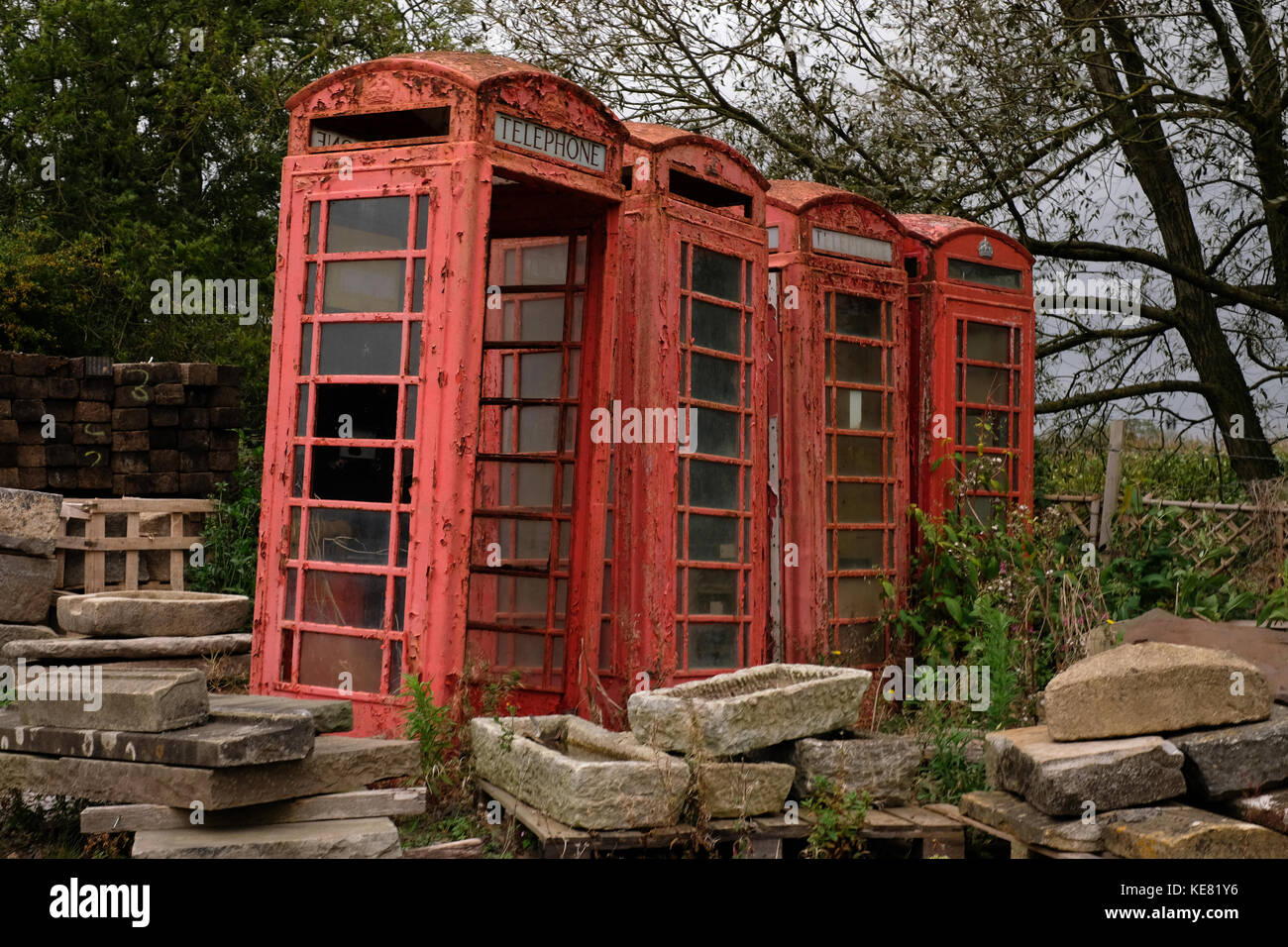 Abandoned red telephone boxes in reclamation yard Stock Photo - Alamy