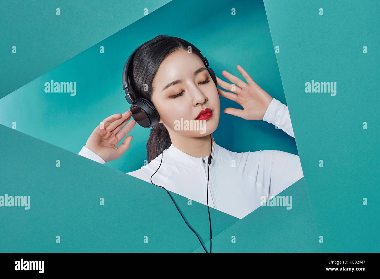 Portrait of young woman listening to music closing her eyes Stock Photo ...