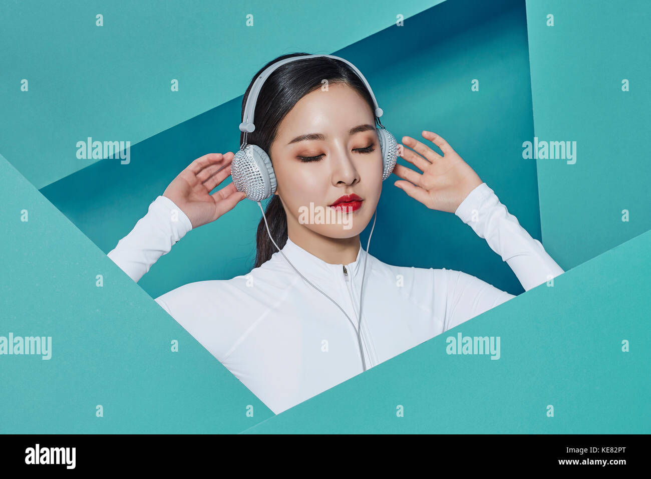 Portrait of young woman listening to music closing her eyes Stock Photo ...