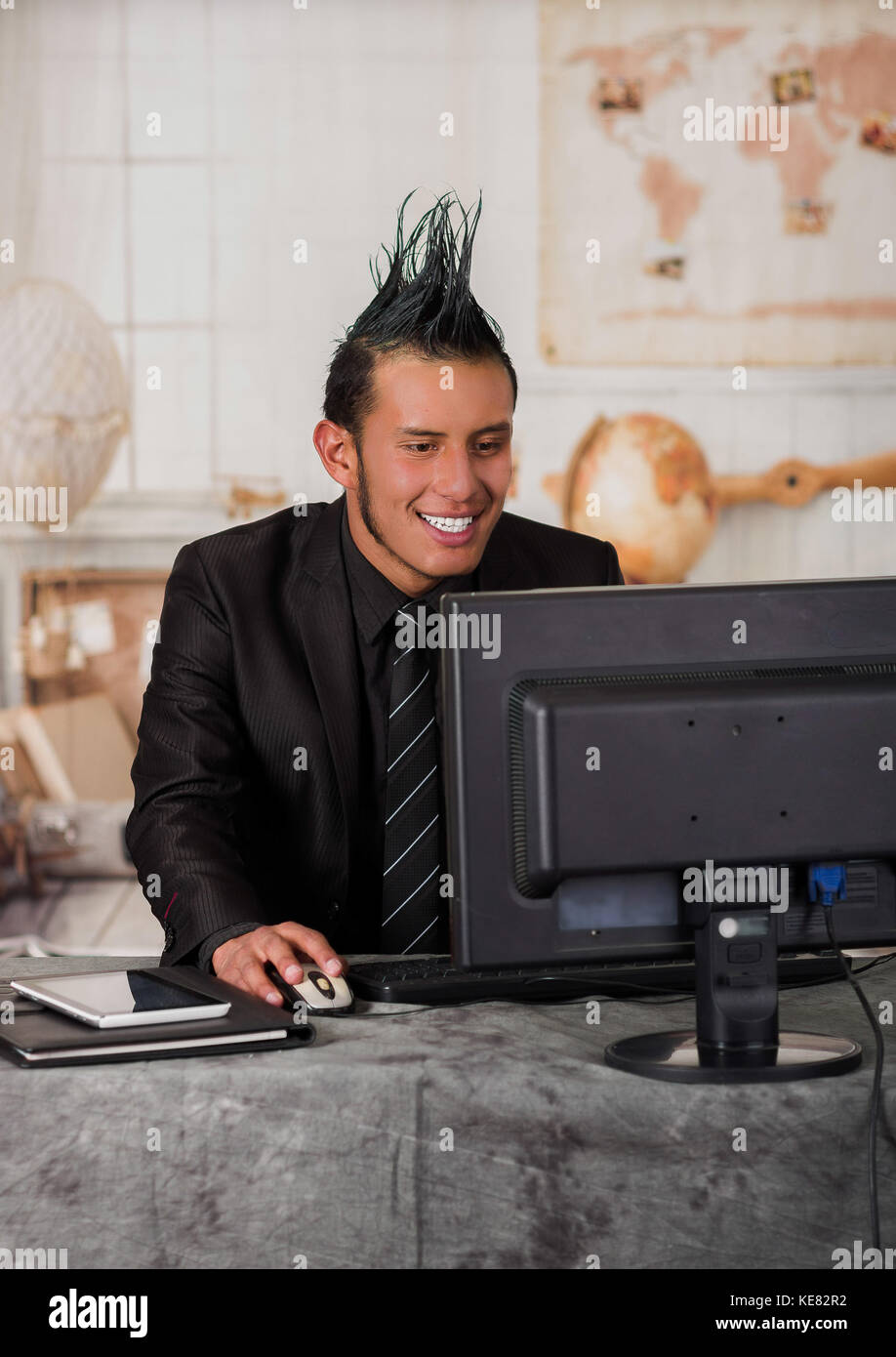 Close up of smiling office punk worker wearing a suit with a crest ...