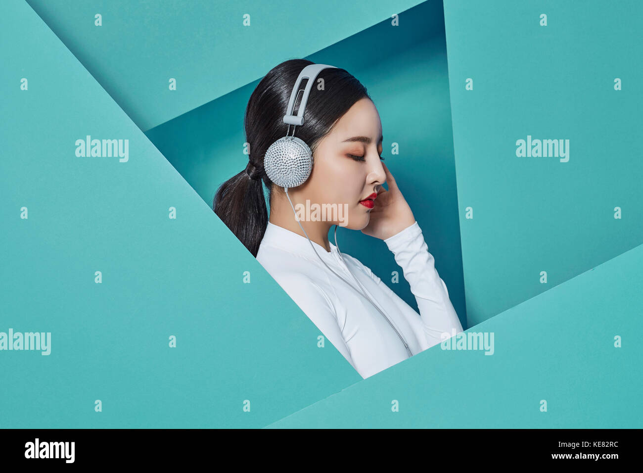 Side view portrait of young woman listening to music closing her Stock ...