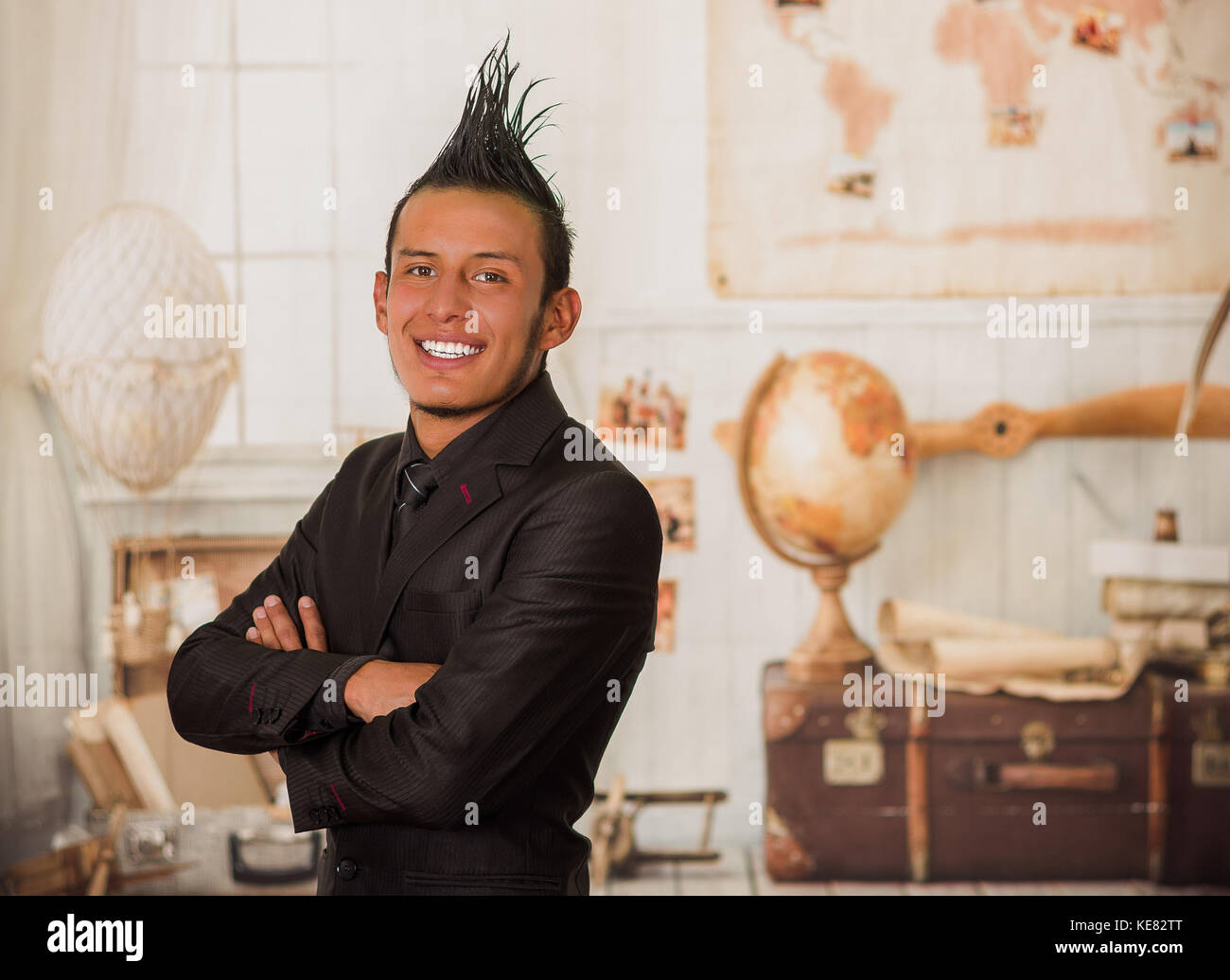 Close up of office punk worker wearing a suit with a crest, crossing ...