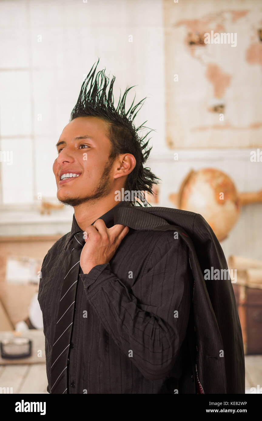 Close up of happy office punk worker wearing a suit with a crest ...