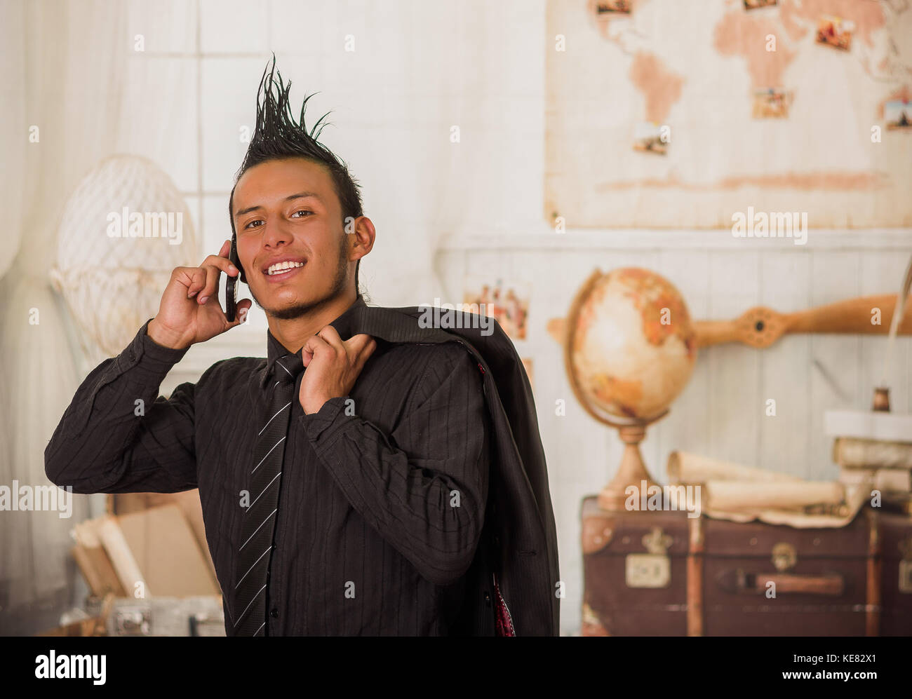 Close up of happy office punk worker wearing a suit with a crest ...