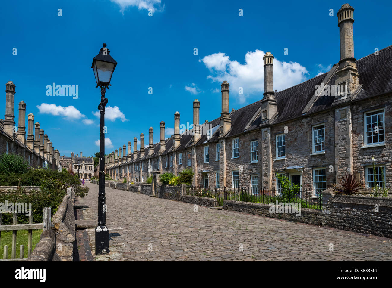Historic houses on Vicars' Close with a street lamp and cobblestone ...