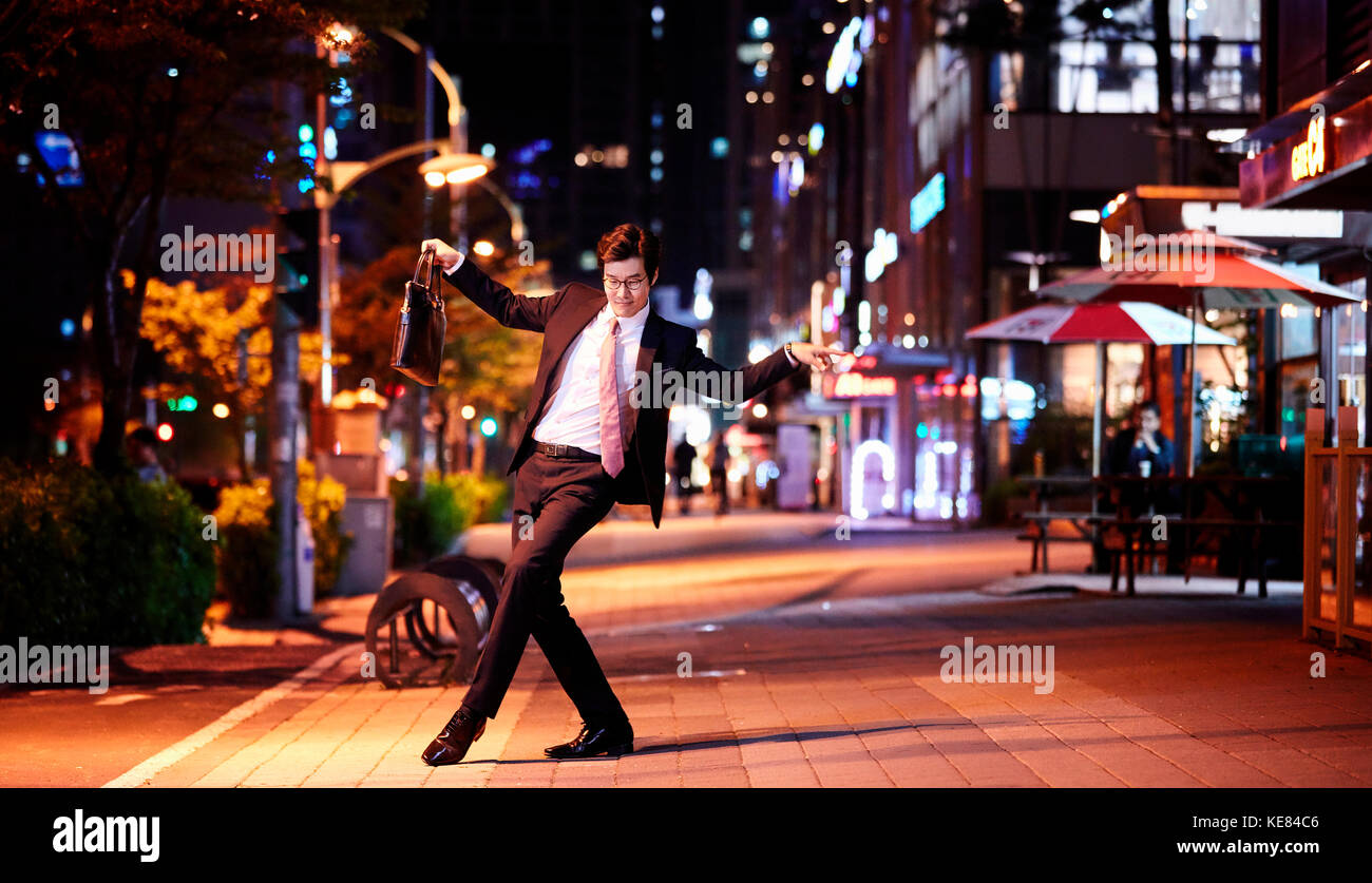Man in dark suit dancing hi-res stock photography and images - Alamy