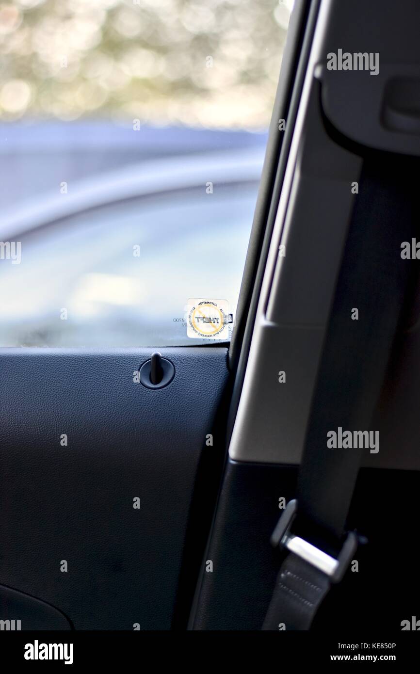Theft sticker next to door lock Stock Photo - Alamy