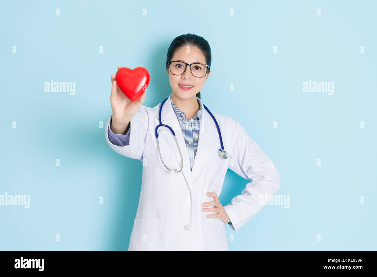 selective focus photo of young beautiful female cardiologist showing ...