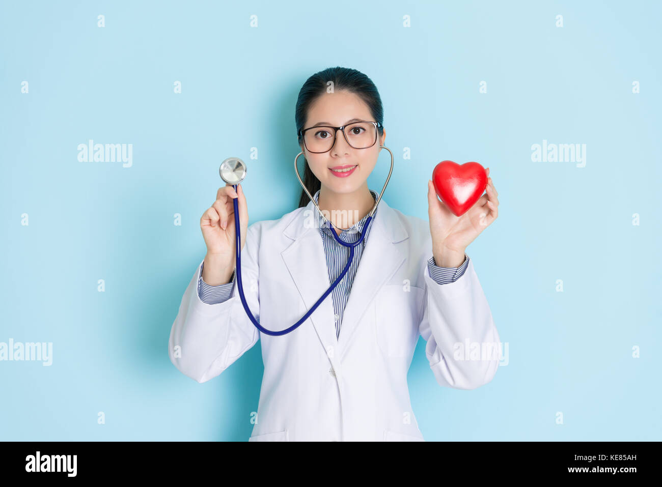 smiling professional cardiologist woman carrying stethoscope and ...