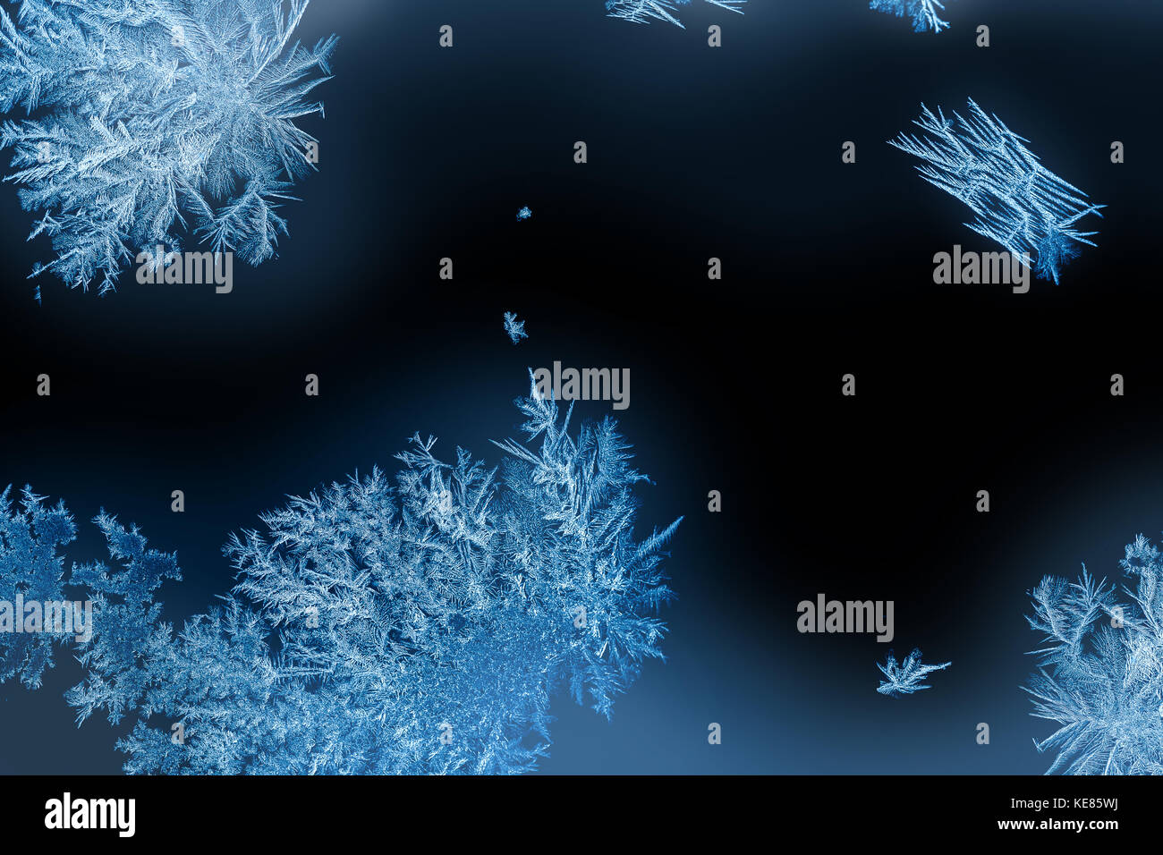 Frozen windows in winter time with frost decorations Stock Photo - Alamy