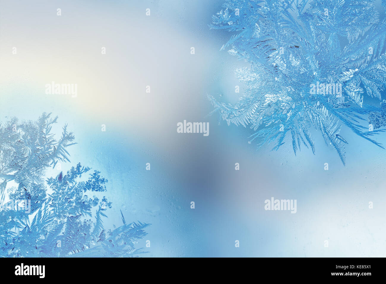 Frozen windows in winter time with frost decorations Stock Photo - Alamy