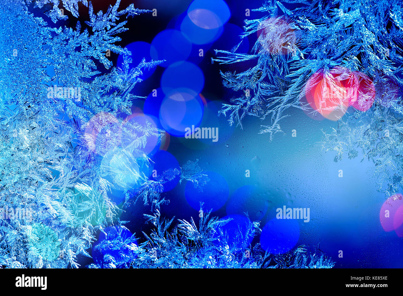 Frozen windows in winter time with frost decorations Stock Photo - Alamy