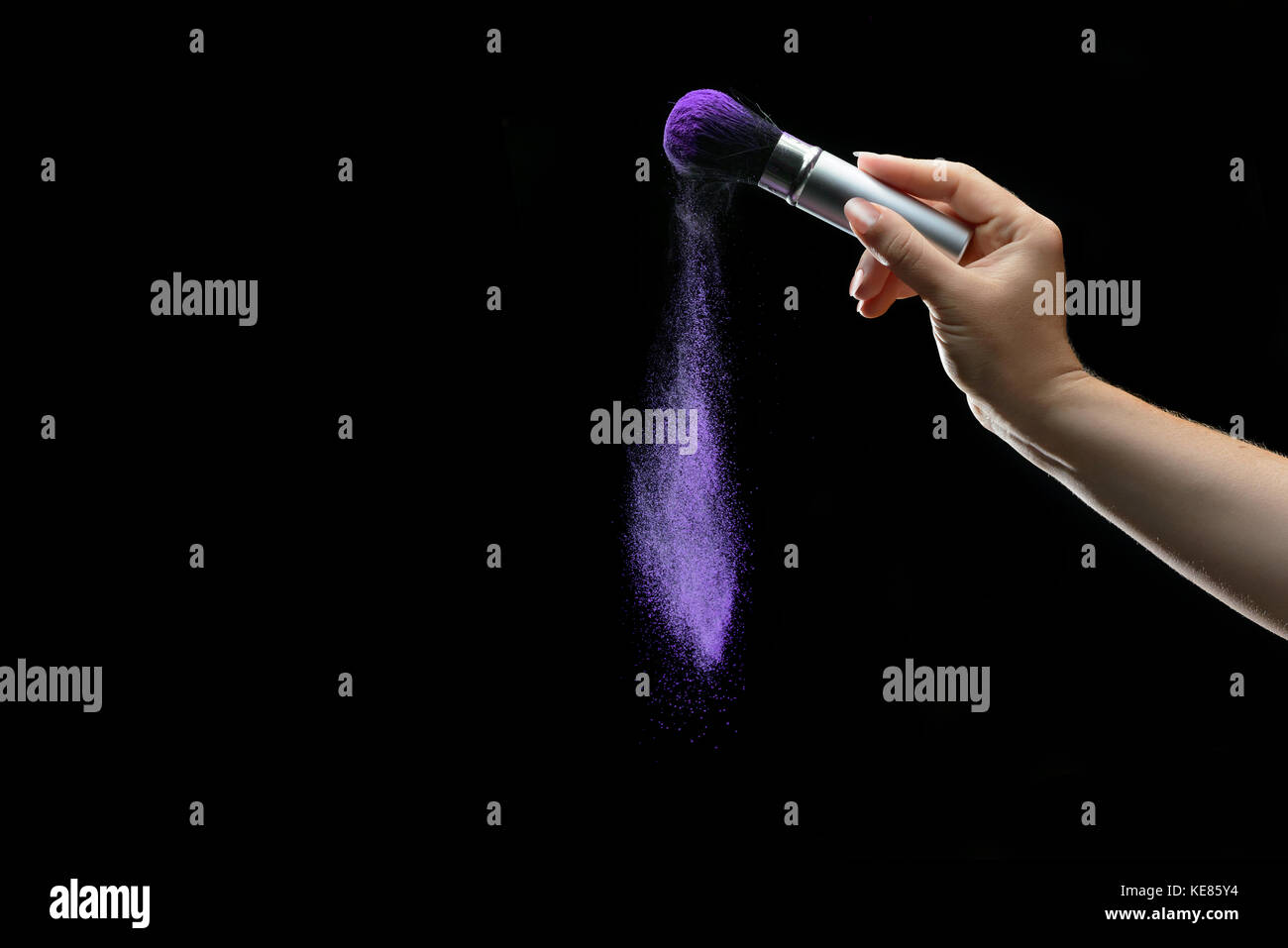 Makeup brush covered with bright holi dry powder paint Stock Photo - Alamy