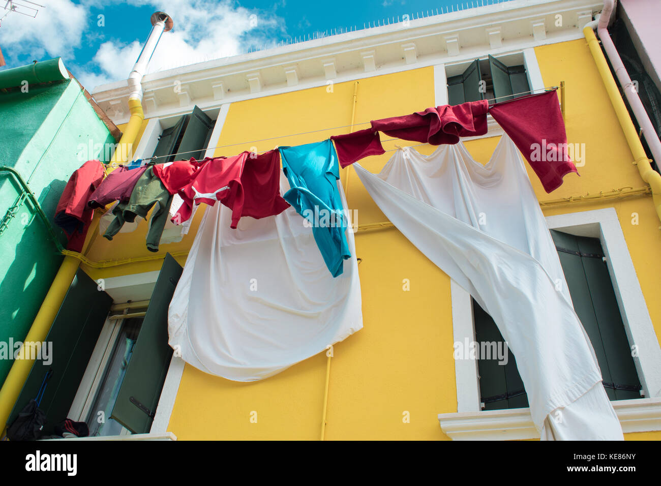 Linen drying on the clothesline outside the window Stock Photo - Alamy