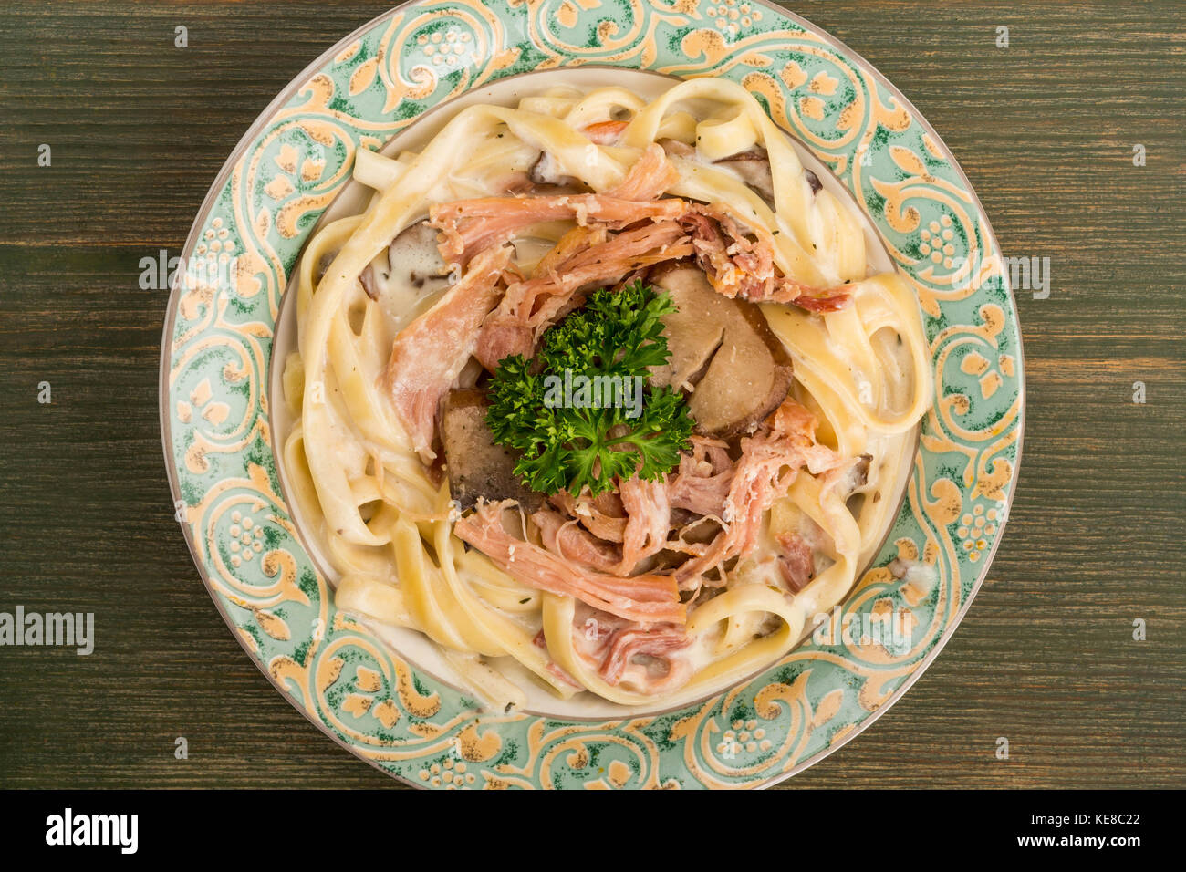 Italian Style Ham and Mushroom Tagliatelle Pasta On A Green Background ...