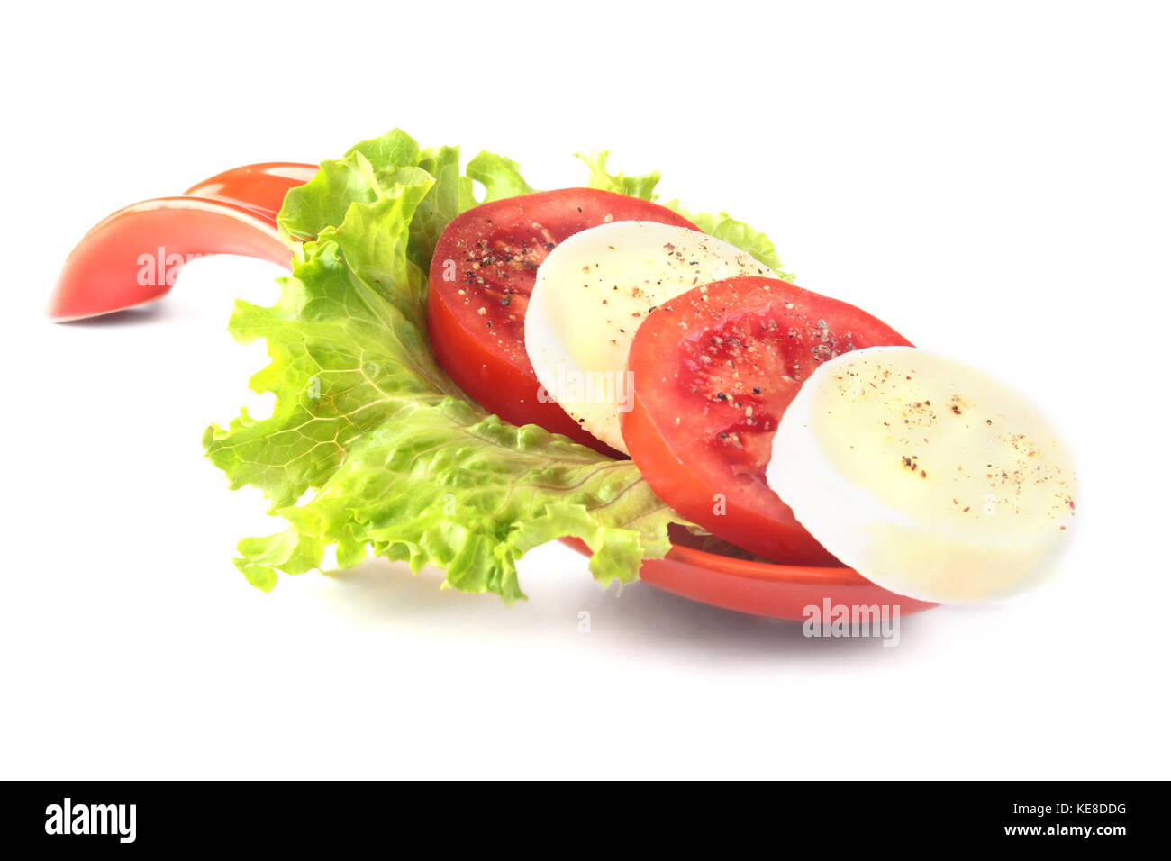 Portion of Mozzarella with Tomatoes, lettuce leaf and Balsamic dressing ...