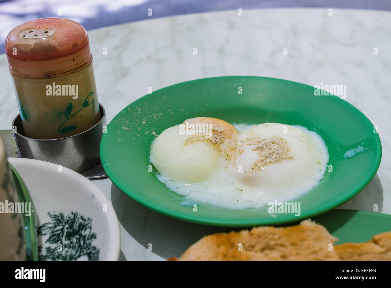 Half-boiled eggs, Traditional Singapore Breakfast called Kaya Toast, Original bread toast with ...