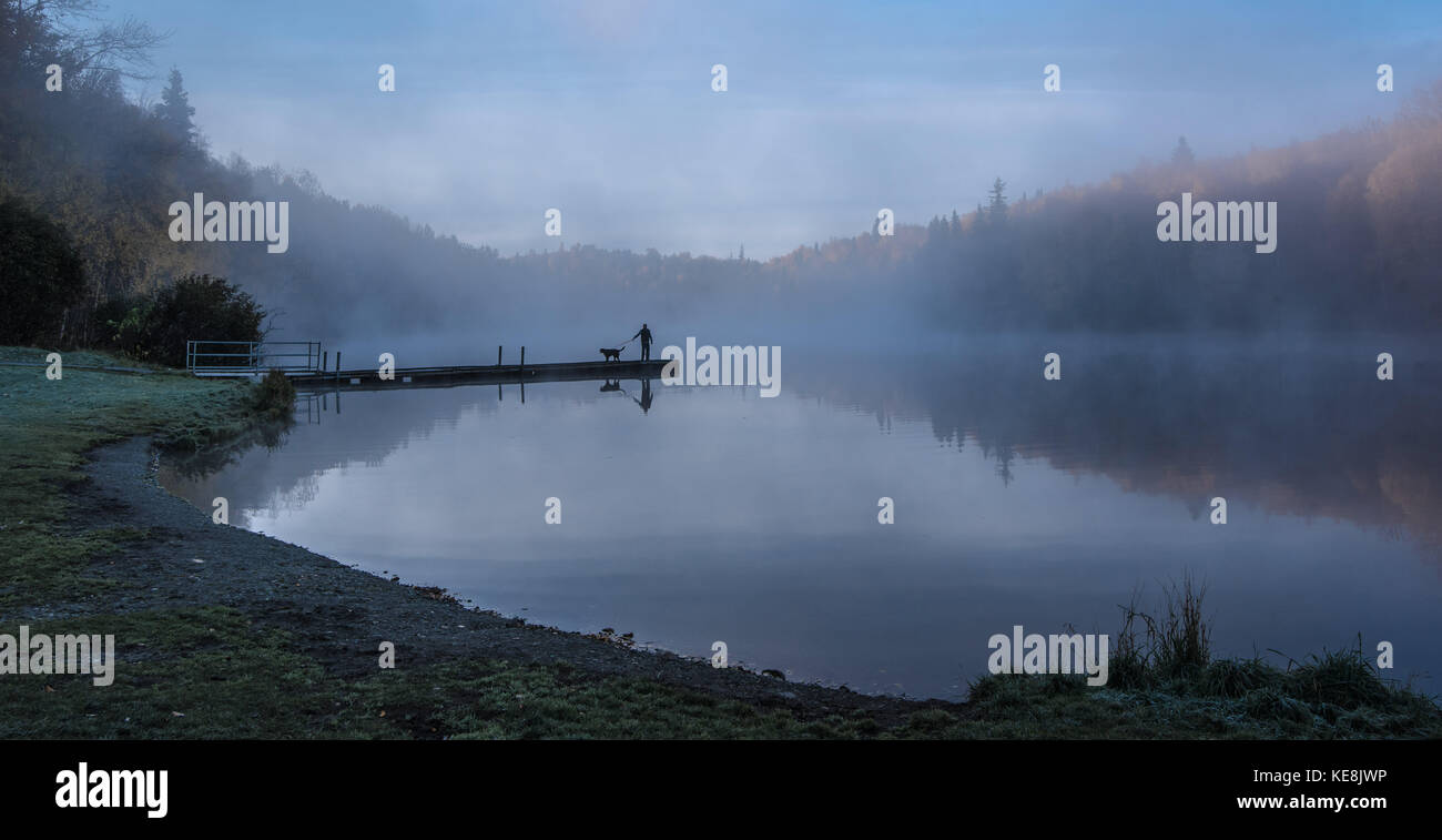 Man with dog on dock hi-res stock photography and images - Alamy