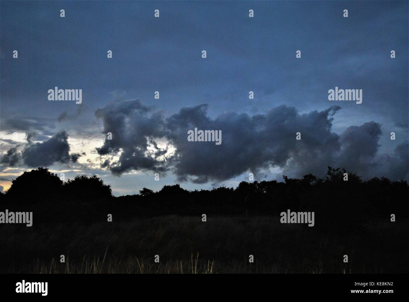 Evening mixed cloud formation with cool colours Stock Photo - Alamy