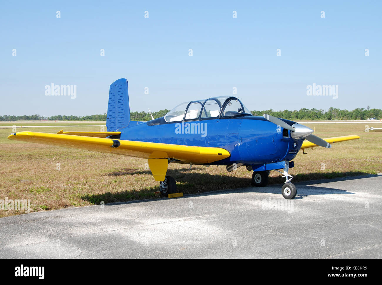 Classic blue colored airplane on the ground Stock Photo - Alamy