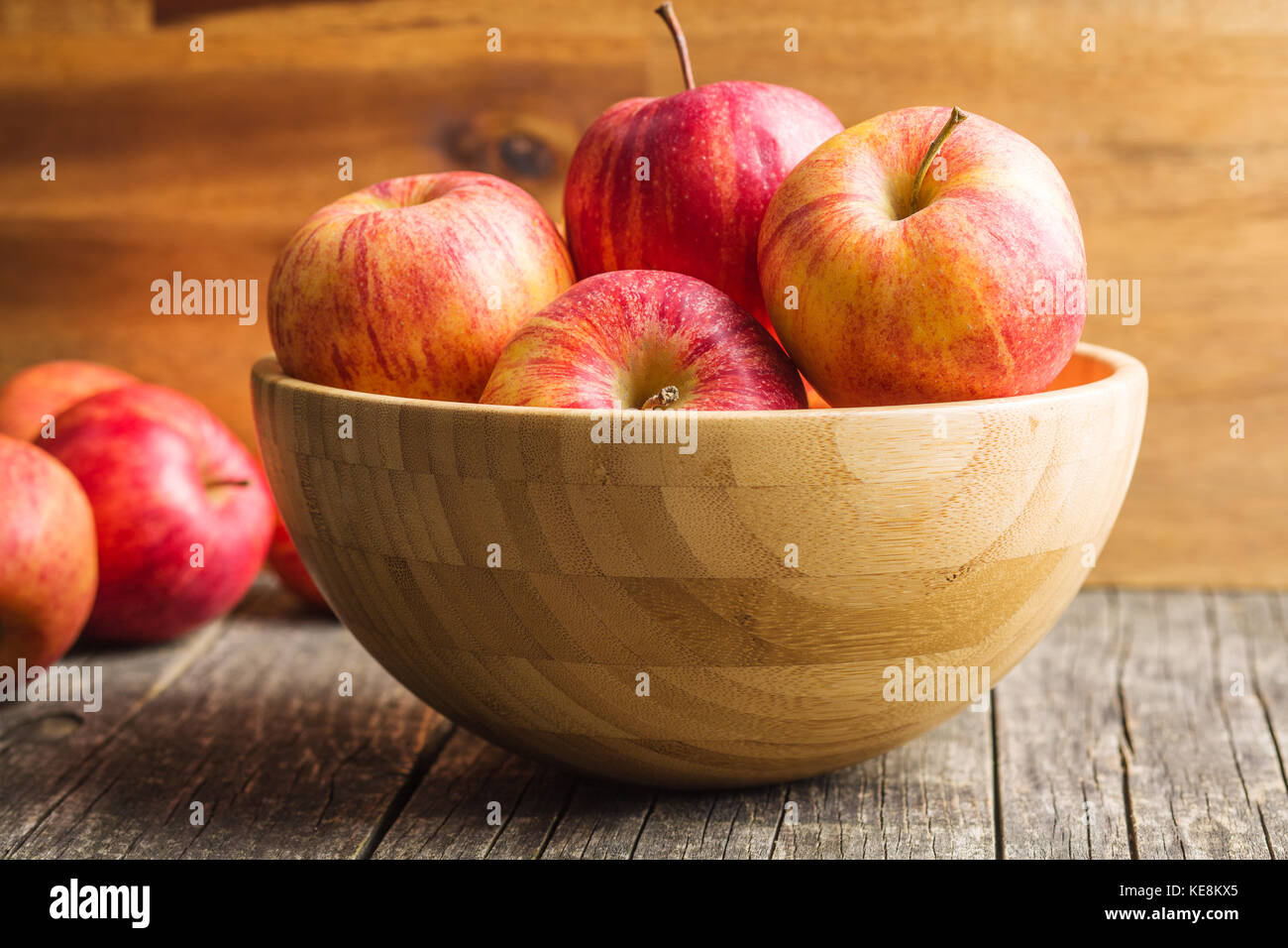Fresh red apples in wooden bowl Stock Photo - Alamy
