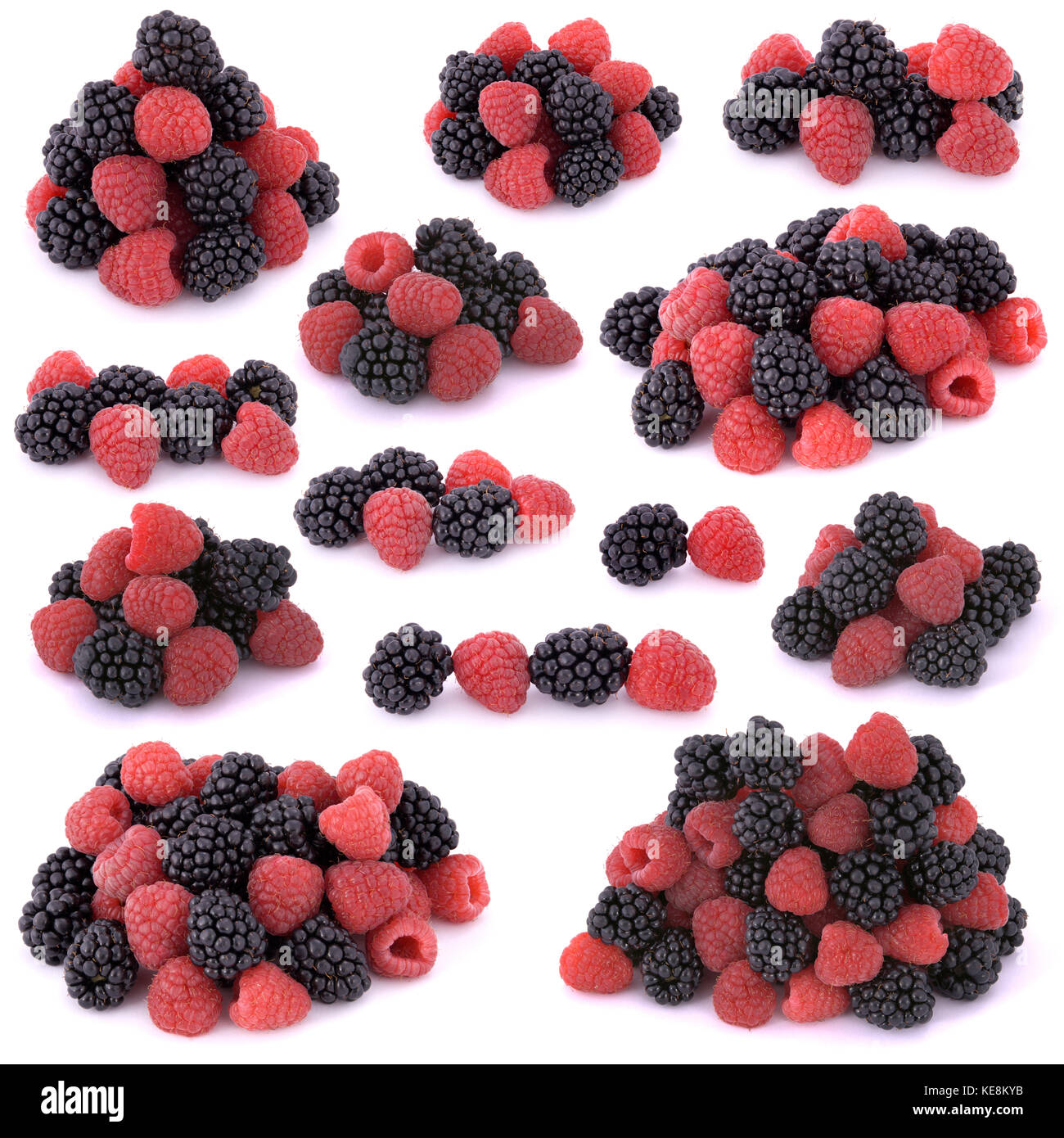Raspberries and blackberries on white background Stock Photo - Alamy