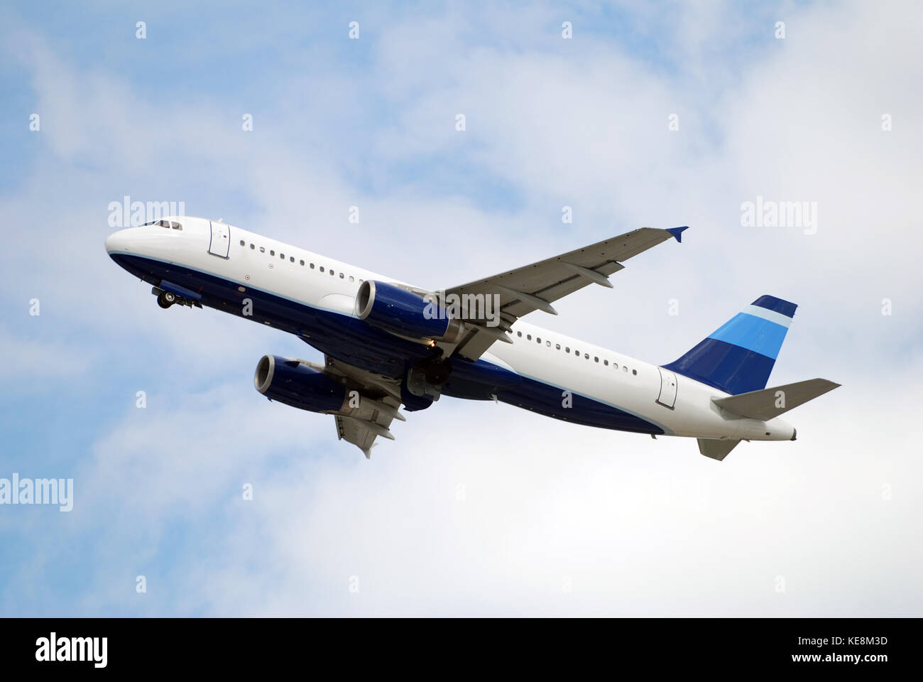 Modern passenger jet airplane taking off Stock Photo - Alamy