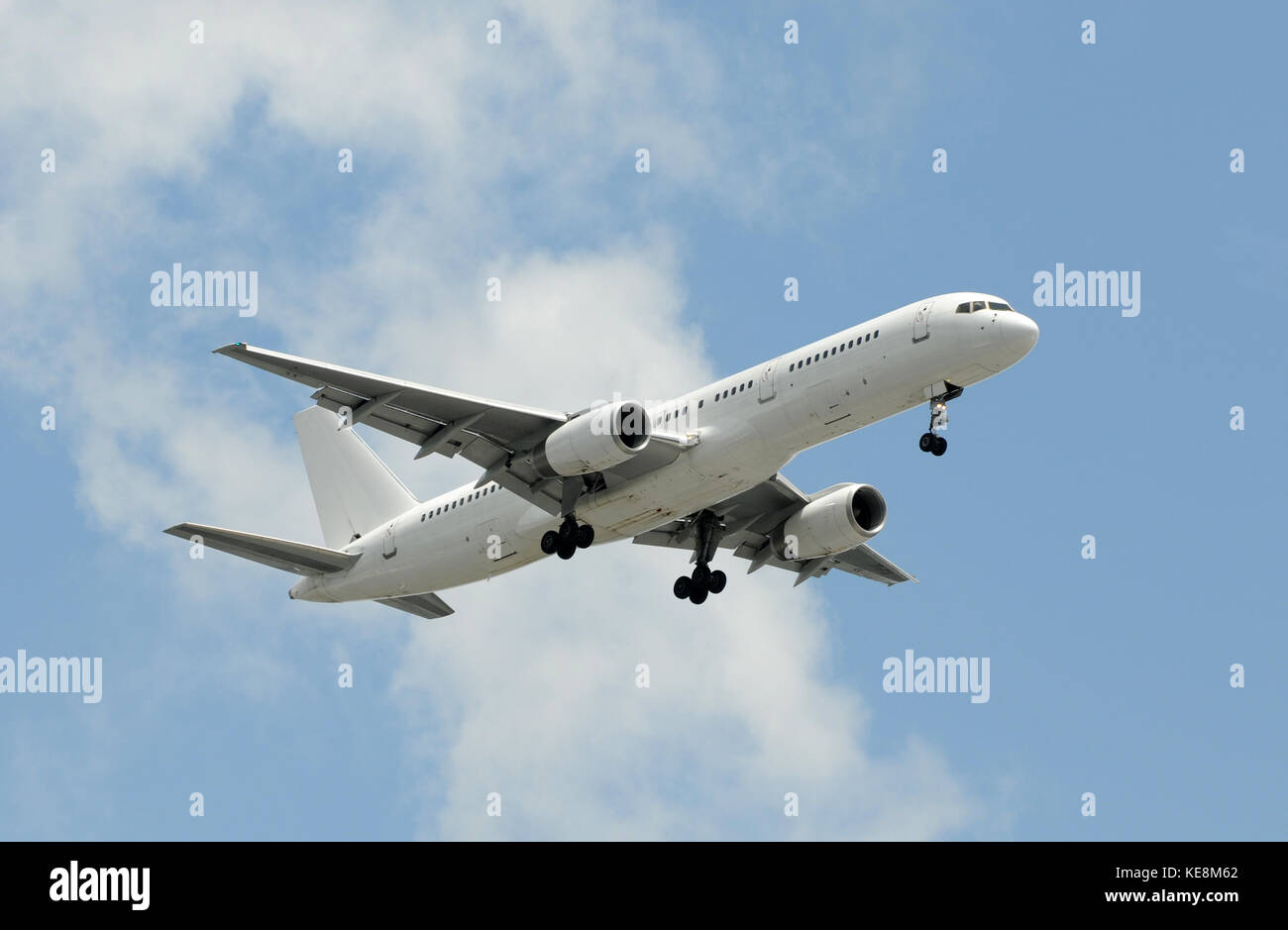 Unmarked passenger jet airplane in flight Stock Photo - Alamy