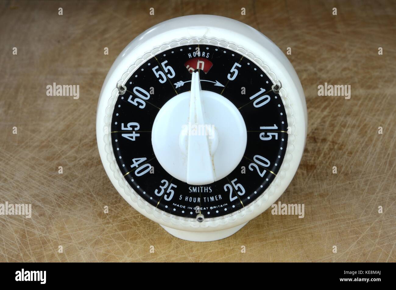 Retro Smiths Kitchen Timer circa 1972 on wooden background Stock Photo ...