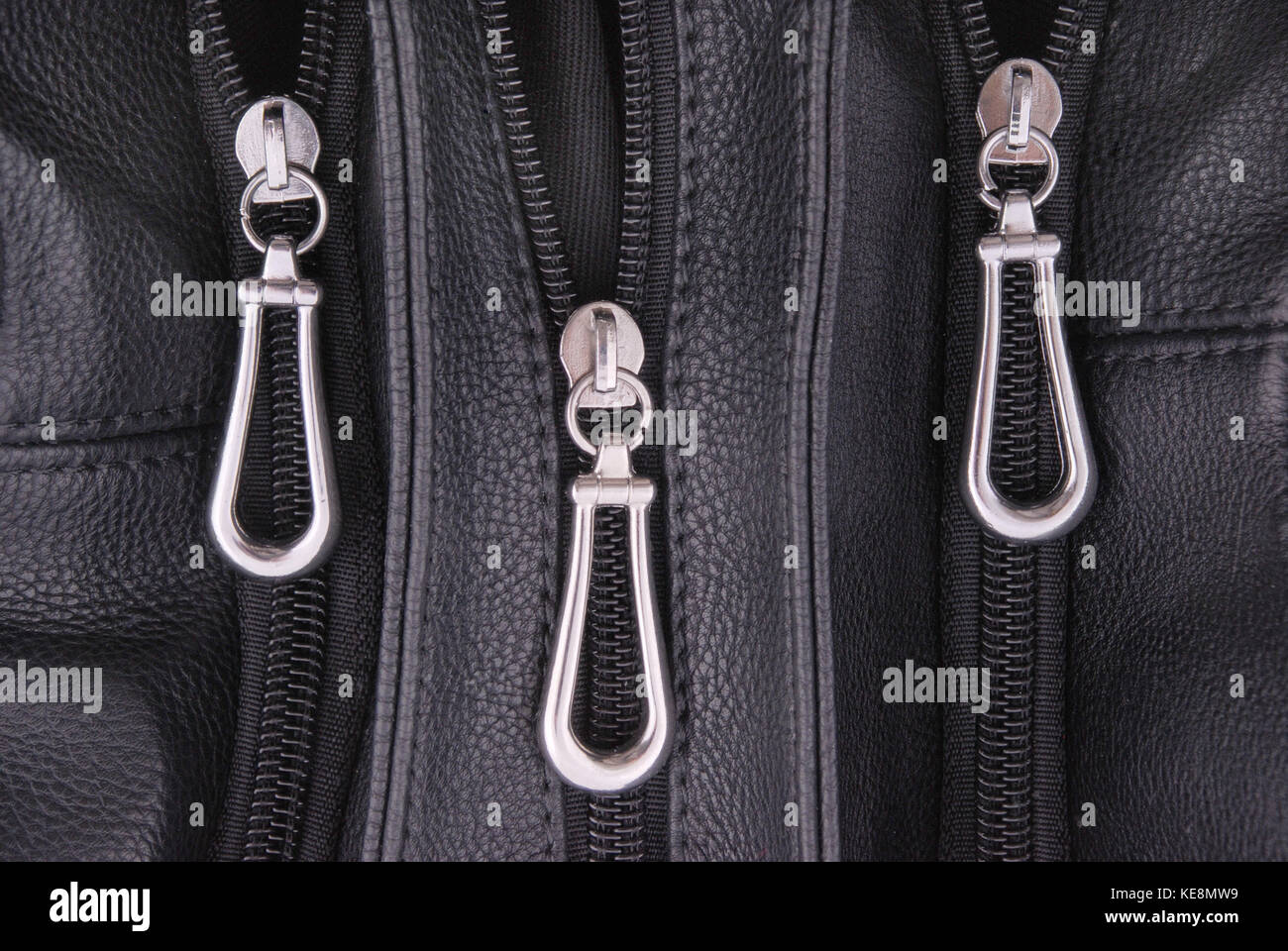 Three black zipper Stock Photo - Alamy
