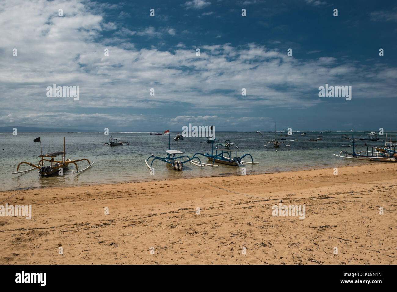 Traditional balinese dragonfly boat on the beach. Jukung fishing boats ...