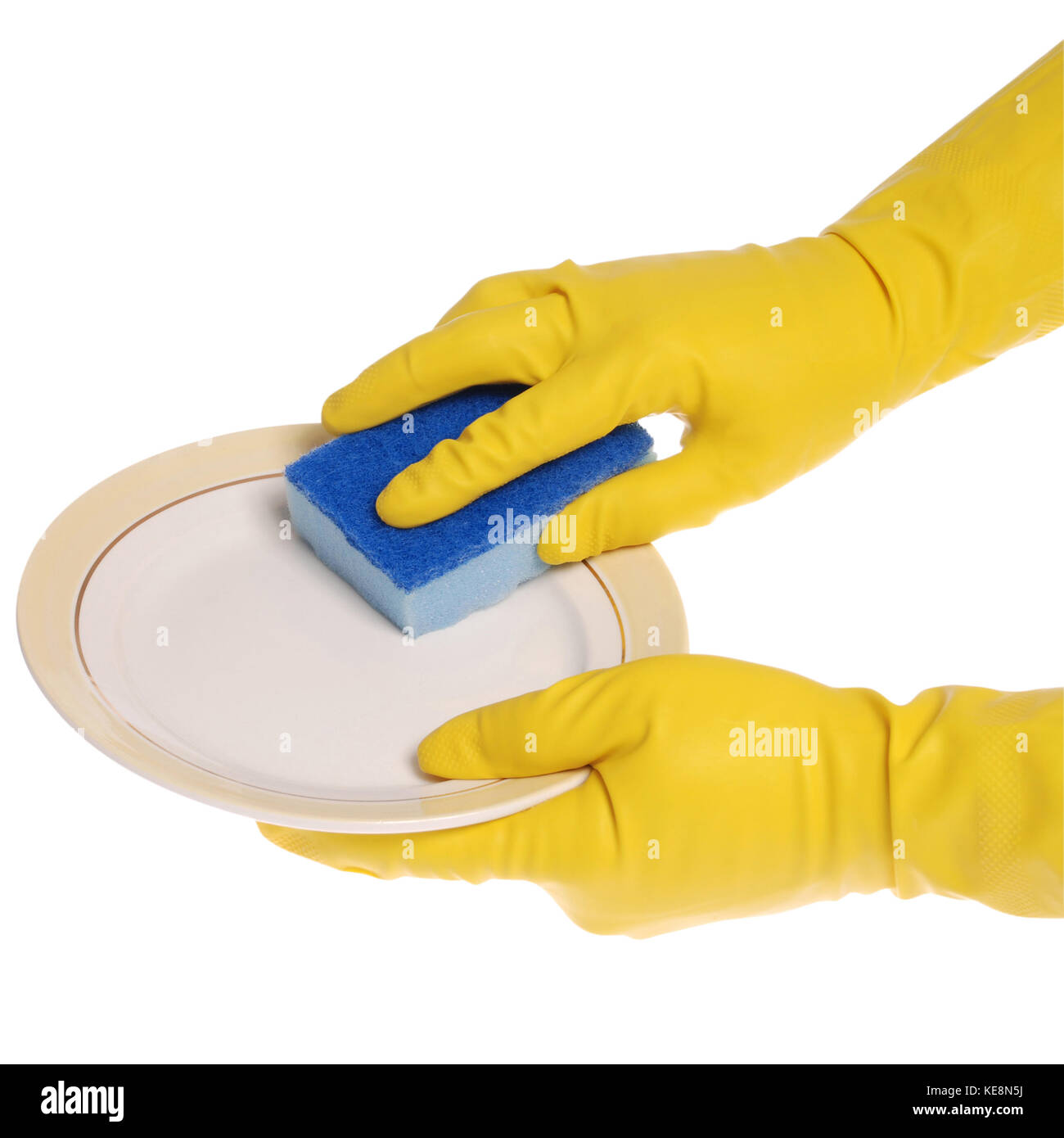 Yellow gloved hands washing a plate with a blue sponge. On white ...