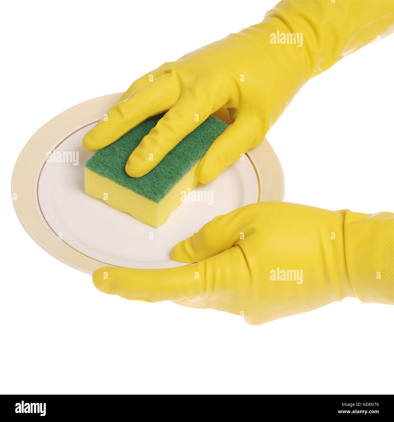 Yellow gloved hands washing a plate with a yellow sponge. On white ...