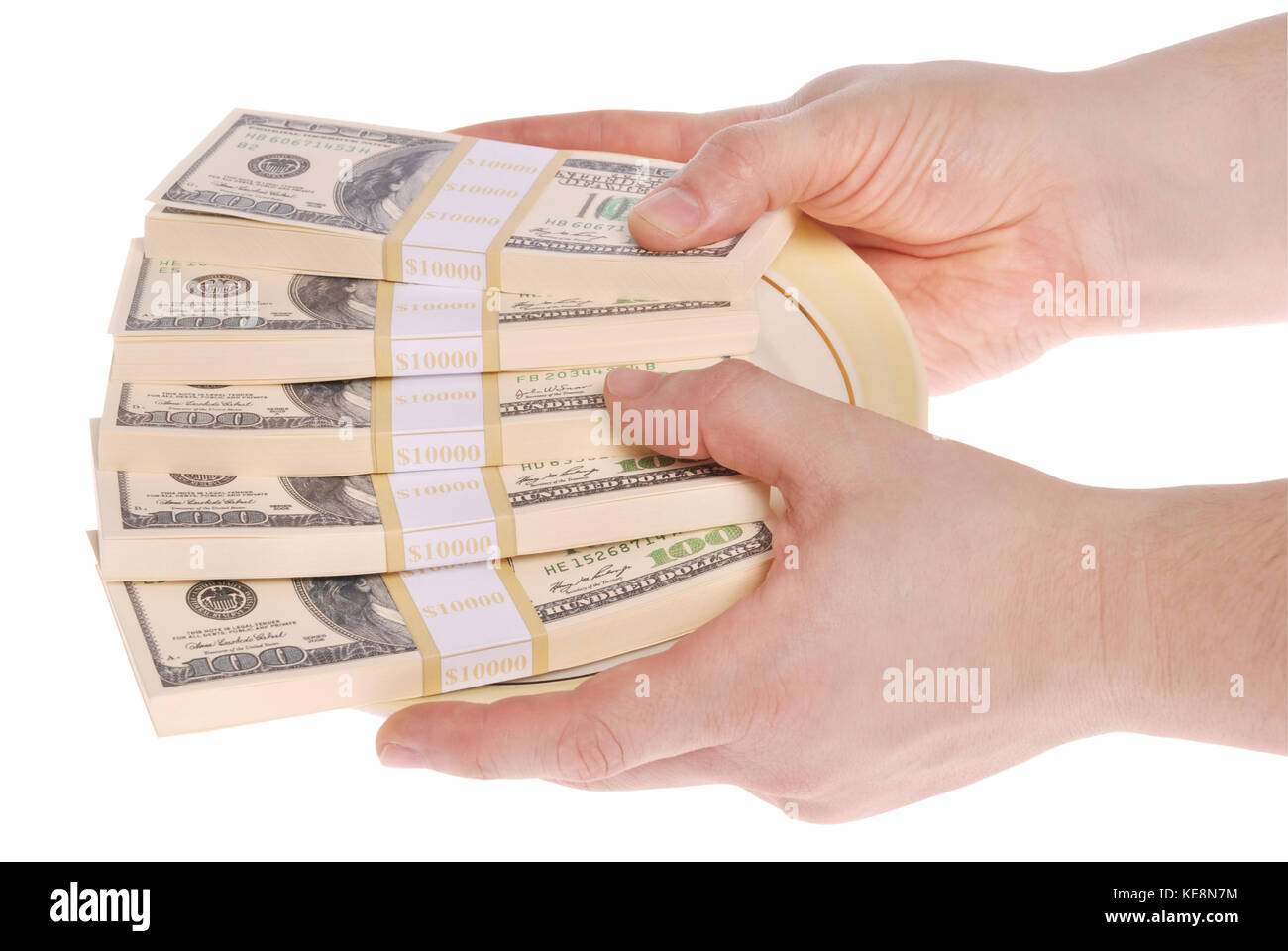 money on plate with hand. Isolated on white. Clipping path included ...