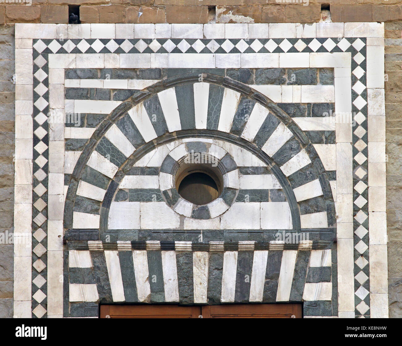 Old marble wall with small oval window Stock Photo - Alamy