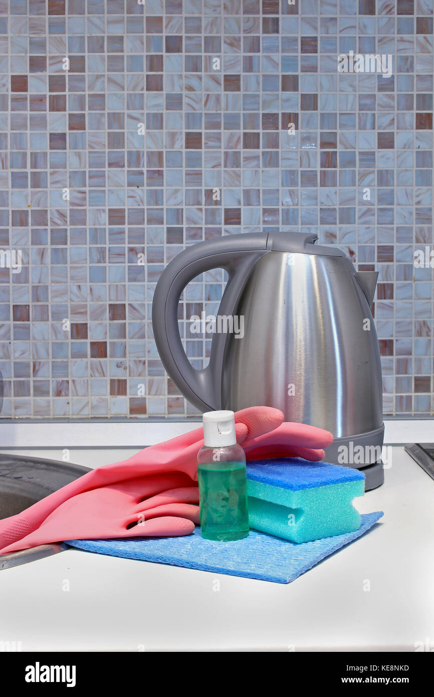 Electric silver kettele with washing equipment on kitchen counter Stock ...
