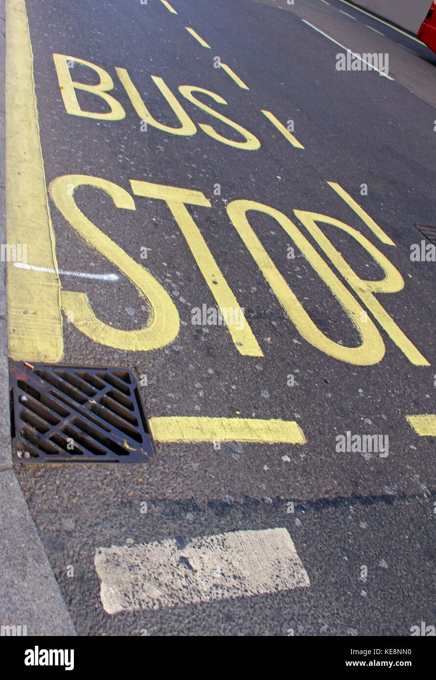 Bus stop sign on pavement on London street Stock Photo - Alamy
