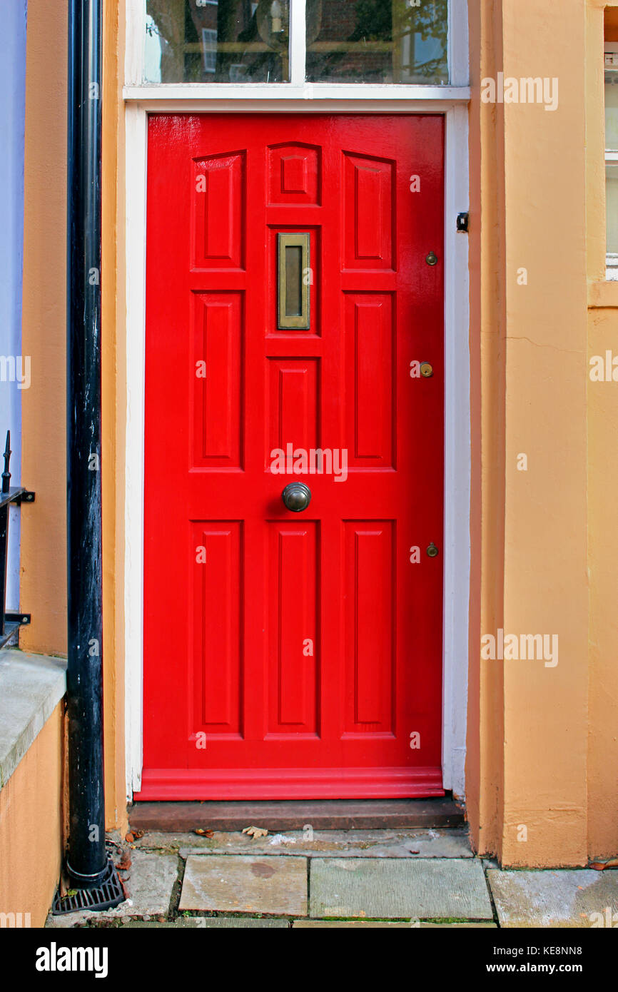 Residential closed front red door from outside Stock Photo - Alamy