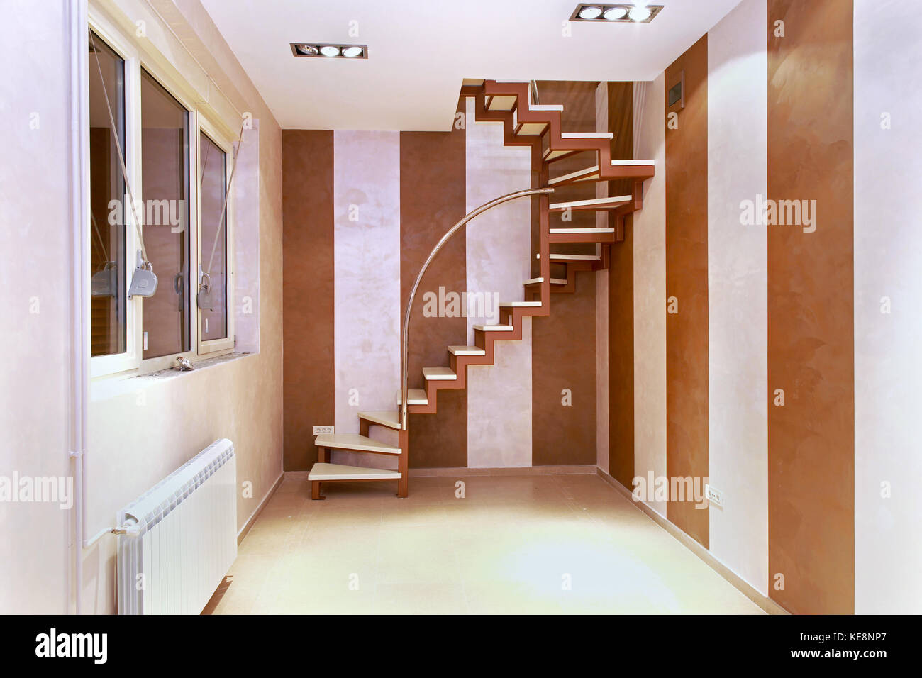 Spiral stairs inside corner of small modern room interior Stock Photo ...