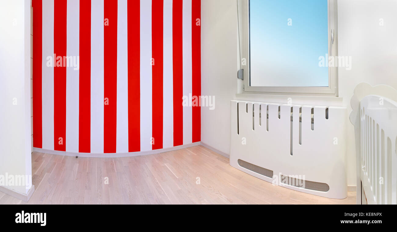 Empty small room interior with red stripes on the wall Stock Photo - Alamy