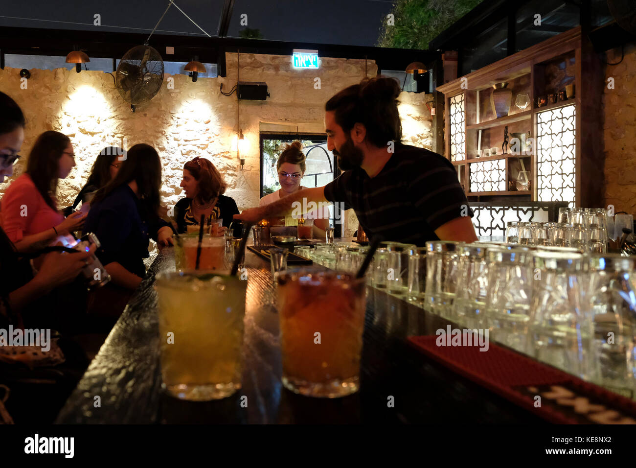 Young Israeli women sitting in Kapara Tapas bar in the old city of ...